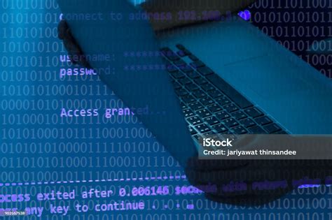 A Computer Programmer Or Hacker Prints A Code On A Laptop Keyboard To Break Into A Secret