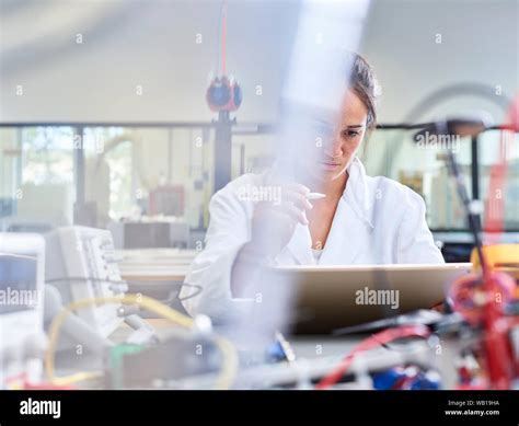 Female Technician Working In Research Laboratory Drawing With Stylus On Tablet Stock Photo Alamy