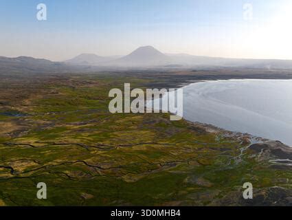 Aerial View Of Lake Natron Meeting The Volcanic Landscape Near The