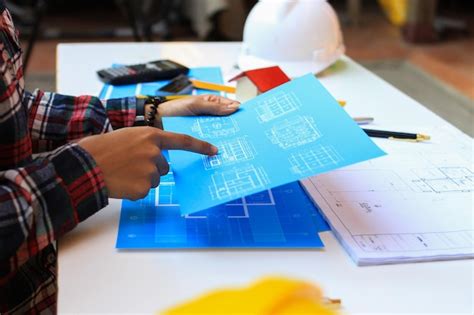 Premium Photo Midsection Of Engineer Brainstorming In Office