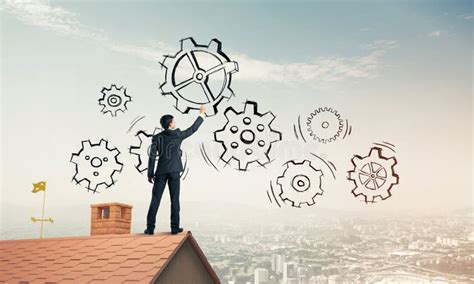 Mister Boss On Brick Roof Standing With Back And Draw Teamwork C Stock