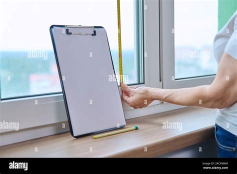 Woman Measuring Window With Tape Measure Tailoring Service Stock Photo Alamy