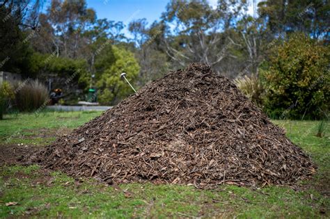 Premium Photo Turning A Compost Pile In A Community Garden Compost