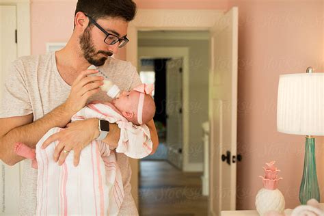 Father Feeding His Daughter By Stocksy Contributor Paige Stumbo Stocksy