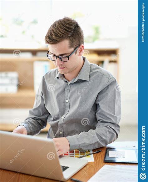 This Isnt Just His Job Its His Passion A Male Designer Working On A