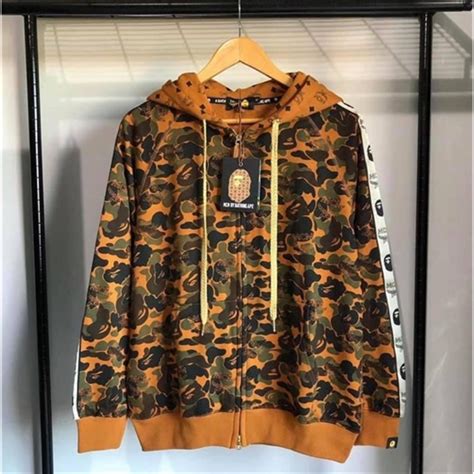 Fashoin เสื้อแจ็กเก็ตเบสบอล แขนยาว ลายพราง มีซิป สไตล์คลาสสิก สําหรับผู้ชาย และผู้หญิง Shopee