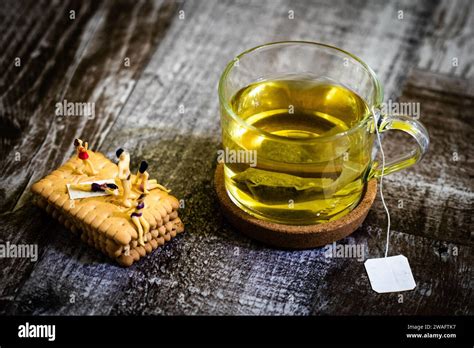 Miniature figures savoring tea Stock Photo - Alamy