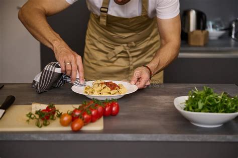 Close Up Man In Beige Chef Apron Using Kitchen Towel Removes Traces