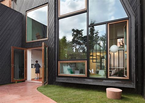 Assorted Windows And Diagonal Cladding Feature On Renovated Home