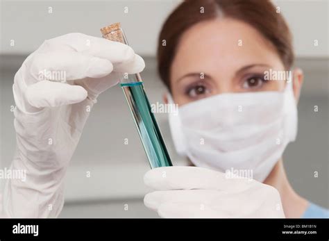 Female Lab Technician Analyzing A Sample In A Test Tube Stock Photo Alamy