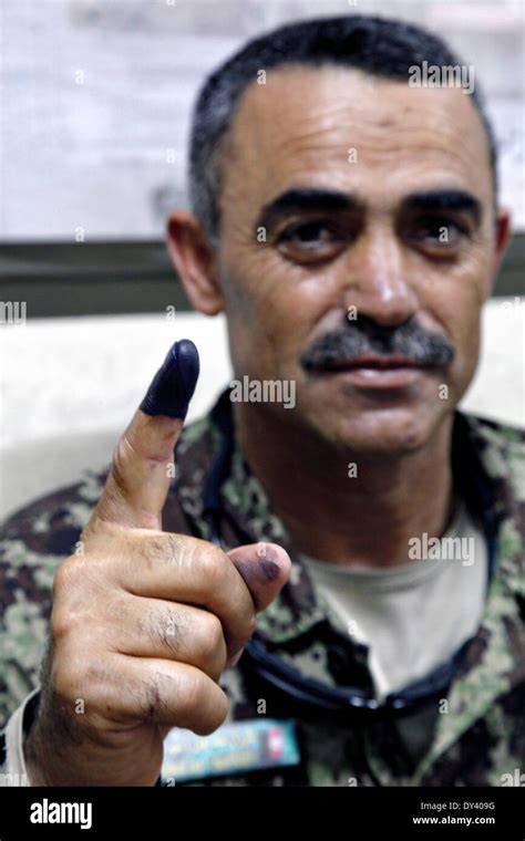 Afghan National Army Soldiers Hold Up Their Fingers Marked With Blue