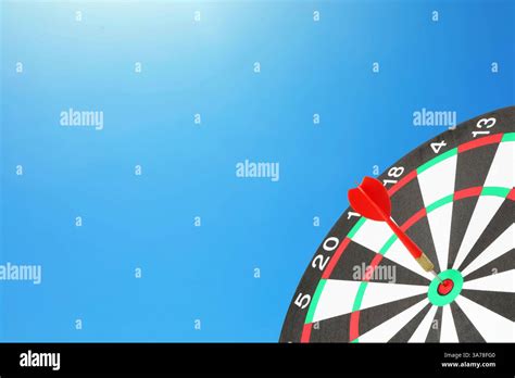 Dart Board With Arrow Against Blue Sky Concepts Of Targeting Decision