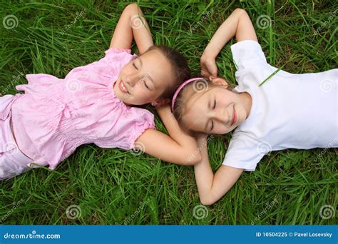 Two Girls Lie On Grass With Closed Eyes Stock Image Image Of Head Friend 10504225