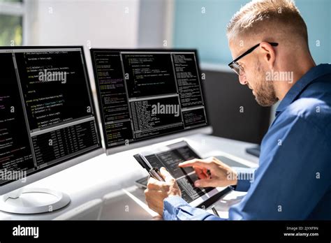 Web Developer Looking At Code Computer Database Software Programming