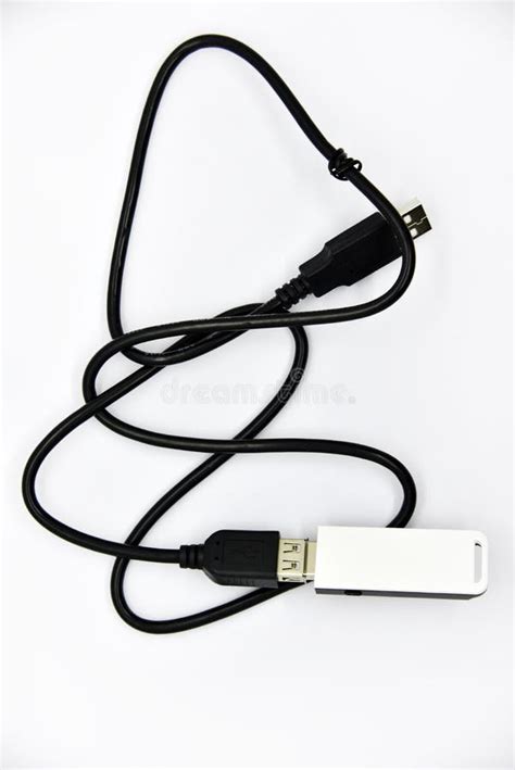 Router On A Black Cable On A White Background A White USB Flash Drive On The Cable Stock Photo