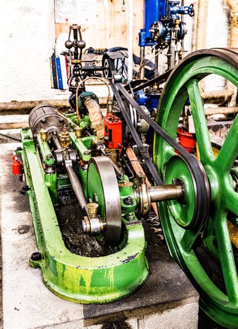 Tractor Engine With Various Gears And Components In The Foreground In