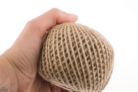 Premium Photo Roll Of Brown Color Linen String On White Background