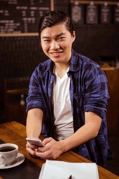 Premium Photo Man Using His Smartphone