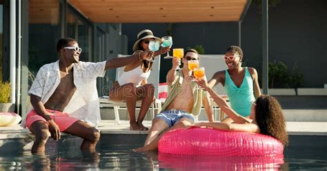 Friends Cocktails And Vacation Toast In Swimming Pool With Happy