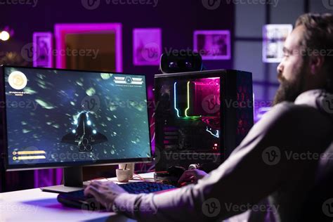 Man Having Fun By Using Gaming Keyboard To Fly Spaceship In Sf