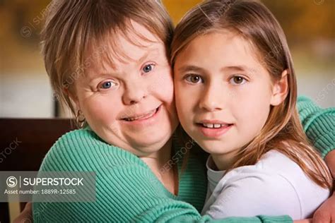 Two Girls Hugging Superstock