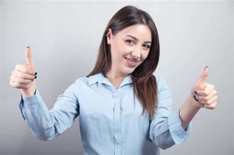 Premium Photo Happy Cheerful Woman Showing Thumbs Up Isolated Gray