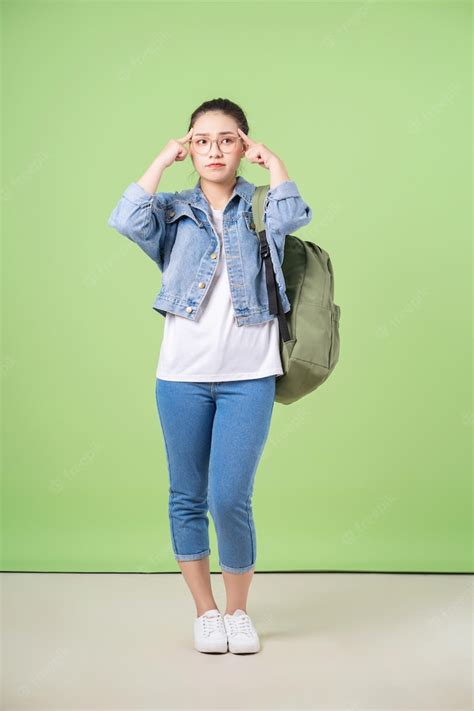 Premium Photo Photo Of Young Asian College Girl On Green Background