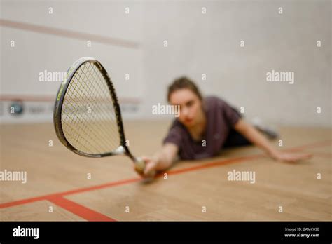 Female Player With Squash Racket Lies On The Floor Stock Photo Alamy