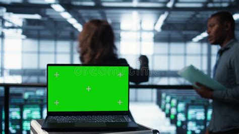 Green Screen Laptop In Front Of Data Center Engineers Inspecting Servers Stock Video Video Of