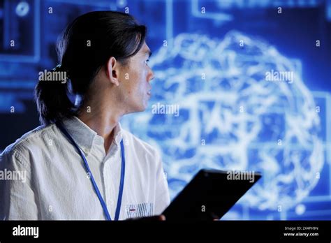 Computer Scientist Using Tablet To Maintenance Artificial Intelligence Neural Networks