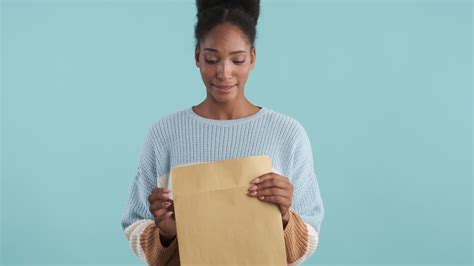Free Stock Video Cheerful Woman Opening Envelope