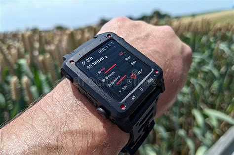 Man Running With Smartwatch Tracking Health And Fitness Data For Exercise Monitoring Stock