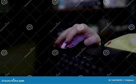 Close Up Of A Woman S Hand Lying On A Computer Mouse The Girl Looks At The Screen Lying On The