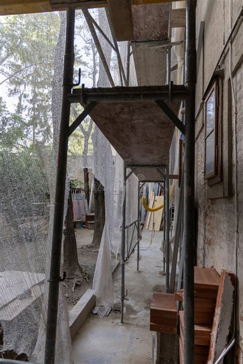 Scaffolding On The Facade Of A Multi Story Building Reconstruction Of