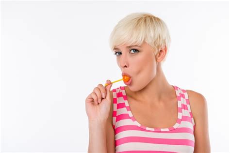 Premium Photo Portrait Of Pretty Girl Licking Lollipop