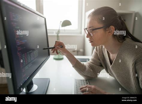 Young Woman Programming At Her Home Office Female Programmer Ponting