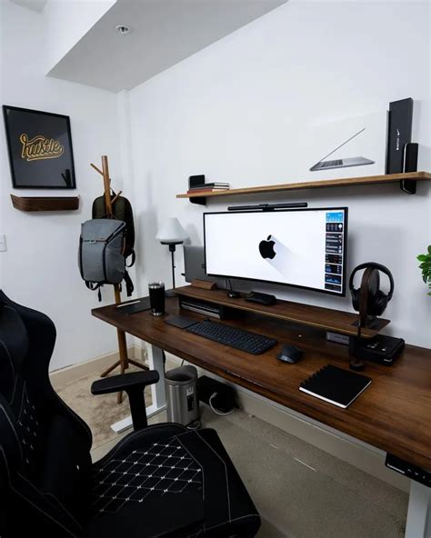 A Computer Monitor Sitting On Top Of A Wooden Desk