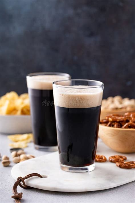 Dark Stout Beer In Tall Glasses On The Table Stock Image Image Of