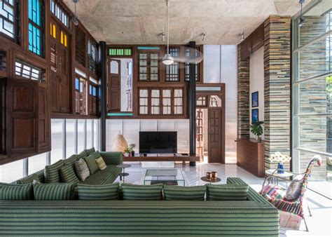 Reclaimed Windows And Doors Form Facades Of Collage House