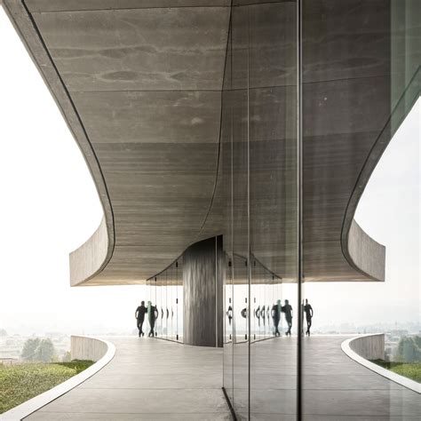 House L27 By Dioniso Lab Is Arranged Around A Curving Courtyard In