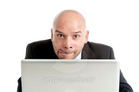 businessman typing on computer keyboard with funny face expression 이미지 522580281 게티이미지뱅크