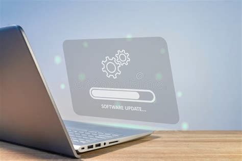 Software System Update Process Concept A Laptop On The Table With Updating Progress Bar On