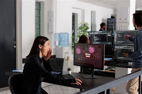 Premium Photo Asian It Programmer Reading Critical Errors On Computer