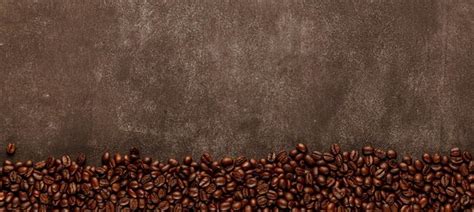 빈티지 돌 질감 배경에 커피 콩 프리미엄 사진