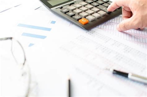 Premium Photo Financial Accounting Closeup Mans Finger Pressing A