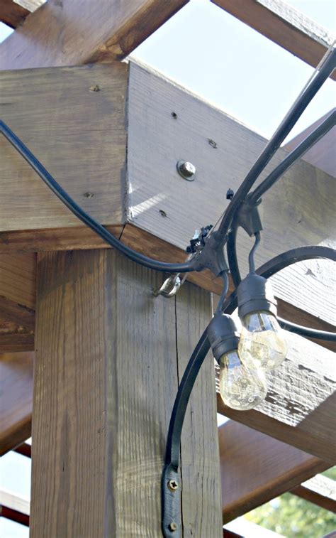 How To Hang Outdoor String Lights Thrifty Decor Chick Thrifty DIY Decor And Organizing