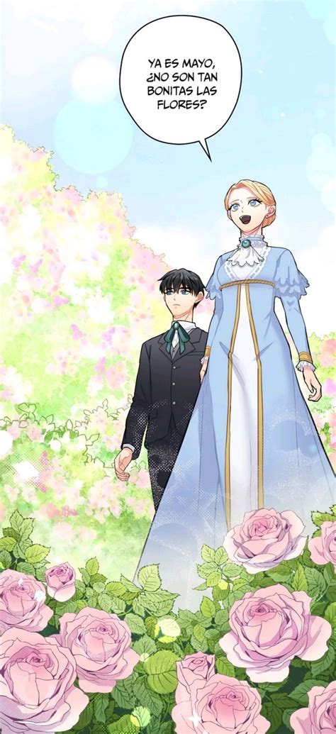 Two People Standing Next To Each Other In Front Of Pink Flowers With A