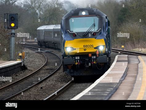 A Class 68 Diesel Locomotive Pulling A Chiltern Railways Mainline Train Passing Through Hatton