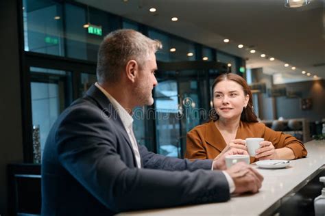 Elegant Man And Woman Sitting At Bar Counter Stock Image Image Of
