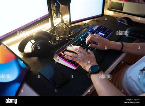 Man Typing On Keyboard Sitting In Front Of Desktop PC Stock Photo Alamy